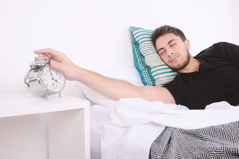 Man with alarm clock. stock image. Image of apartment - 97493471