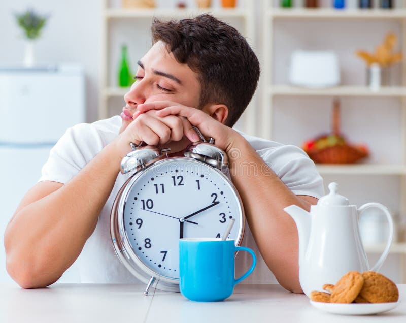 Man with Alarm Clock Falling Asleep at Breakfast Stock Photo - Image of ...