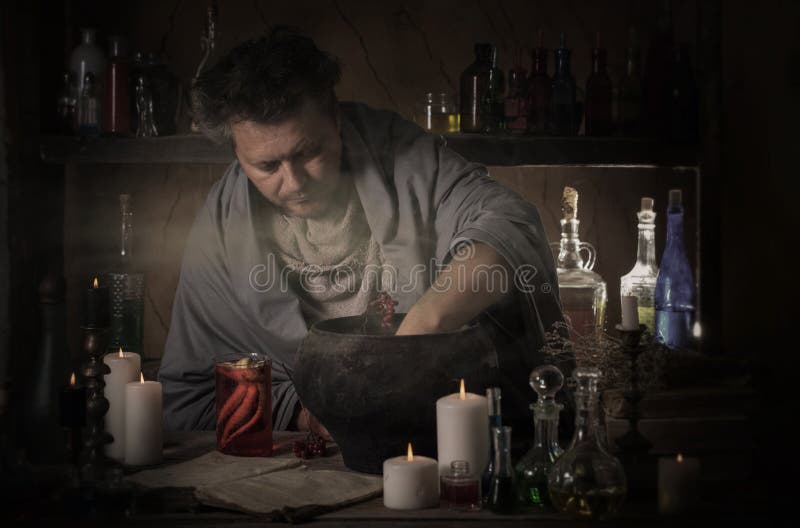Man Alchemist Making Potion in Dark Room Stock Image - Image of ...