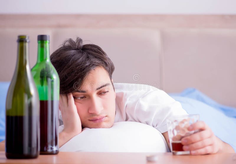 Man Alcoholic Drinking in Bed Going through Break Up Depression Stock ...