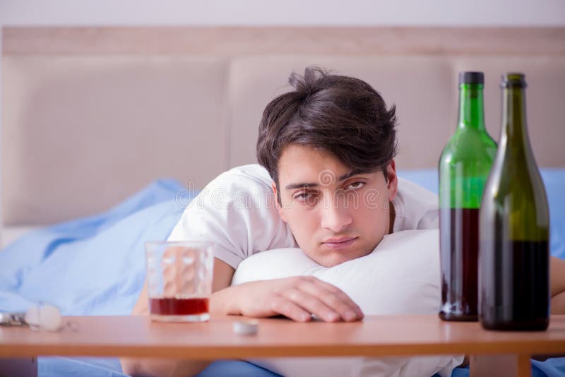 The Man Alcoholic Drinking in Bed Going through Break Up Depression ...