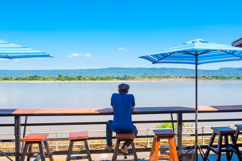 Man Alone Sit on the Balcony Alone Near Riverside Stock Photo - Image ...