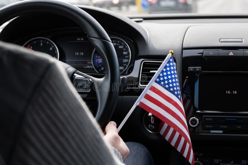 Man with American Flag Driving a Car Stock Photo - Image of license ...
