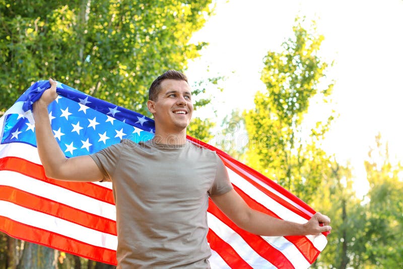 Man with American Flag in Park Stock Photo - Image of holding, large ...