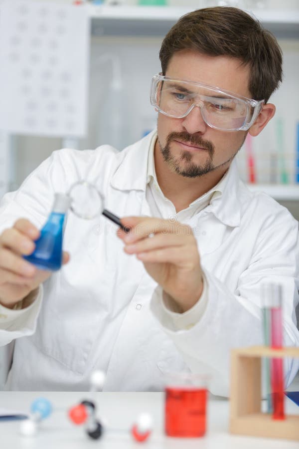 Man Analysing and Evaluating Molecules in Chemistry Lab Stock Image ...