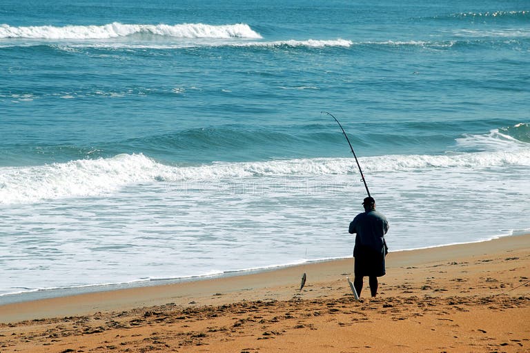 Man Angling in Surf from Beach Stock Photo - Image of recreational ...