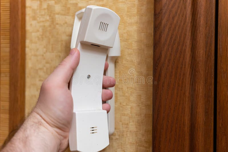 Man Answers the Call To the Intercom, Close-up of the Intercom Stock ...