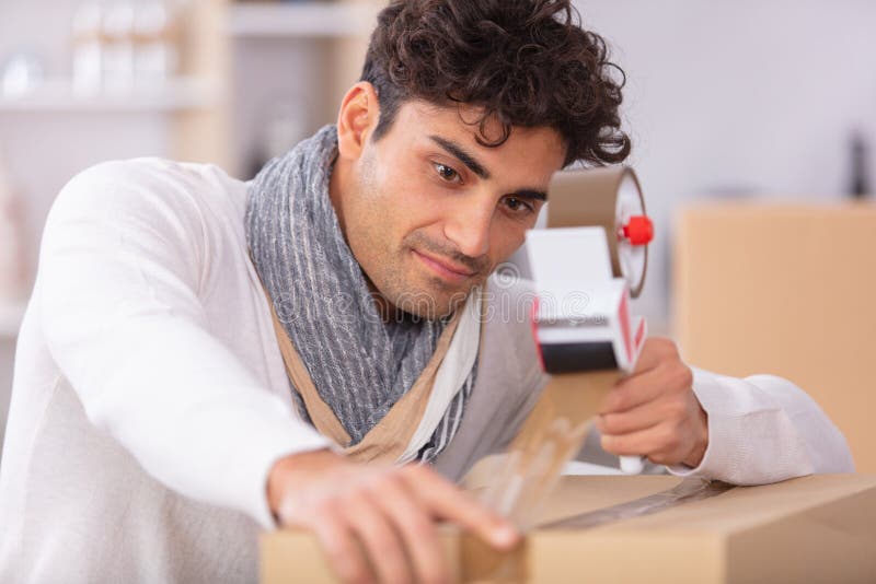 Man Applying Adhesive Tape on Packing Box Stock Photo - Image of ...