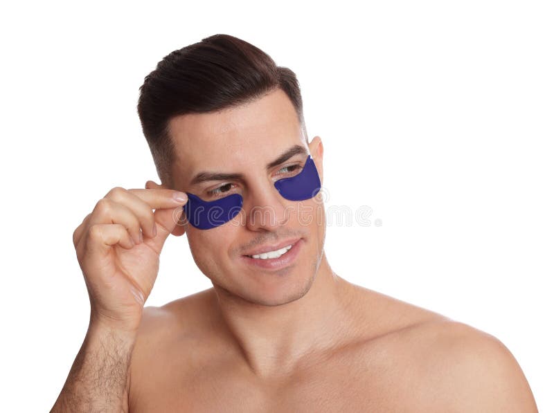 Man Applying Blue Under Eye Patch on Grey Background Stock Photo ...