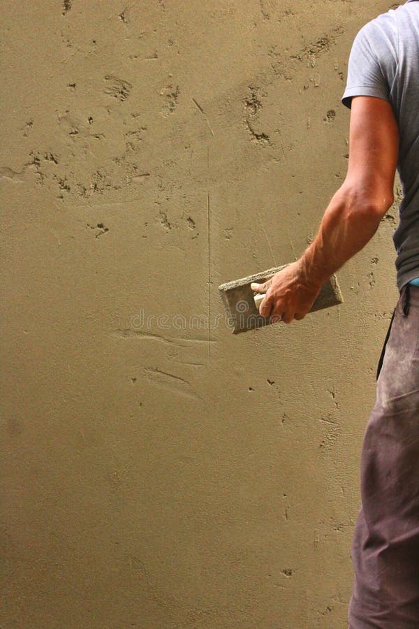 Man Applying Cement on a Wall Stock Image - Image of wall, cement ...