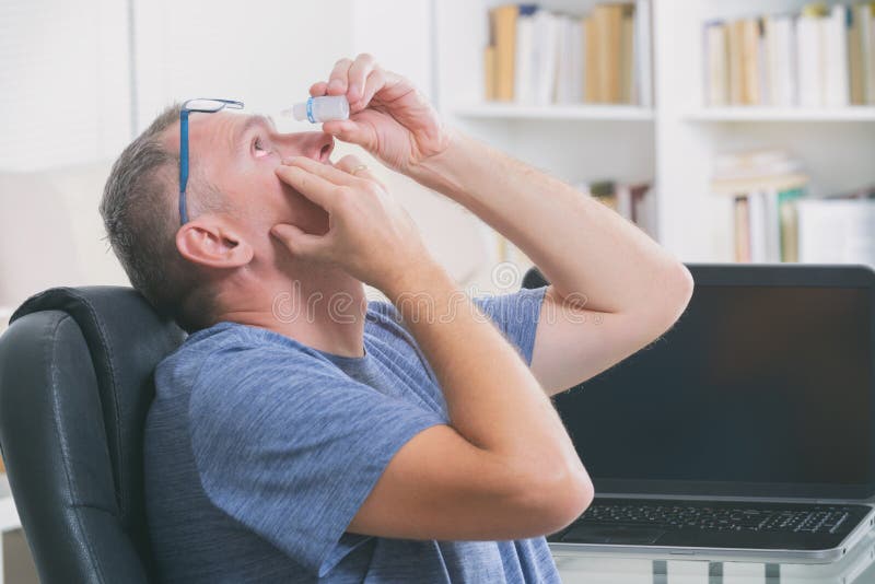 Man applying eye drops stock image. Image of eyesight - 165546273