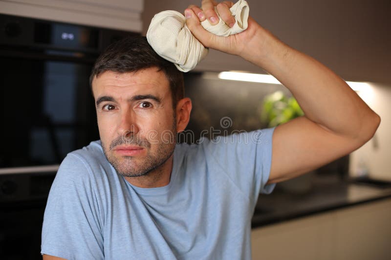 Man Applying Ice To Painful Head Bump Stock Image - Image of suffering ...