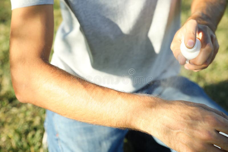 Man Applying Insect Repellent Onto Arm Outdoors, Closeup Stock Image ...