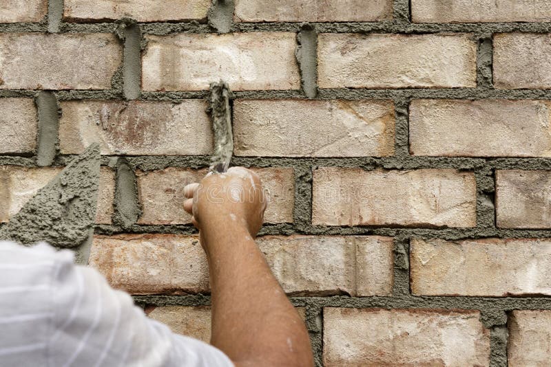 Man applying mortar stock photo. Image of walls, trowel - 56661764