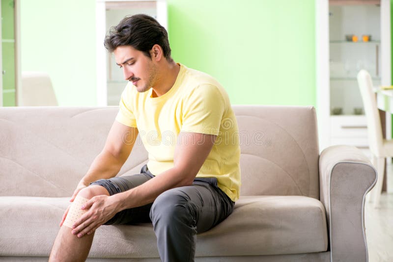 The Man Applying Pepper Capsicum Plaster To Relieve Pain Stock Photo ...