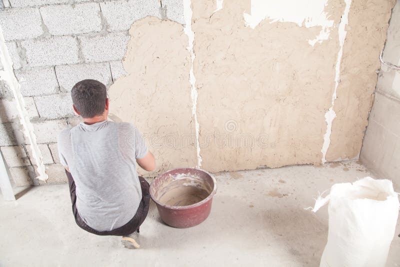 Man is Applying Putty on a Wall. Renovating House Stock Image - Image ...