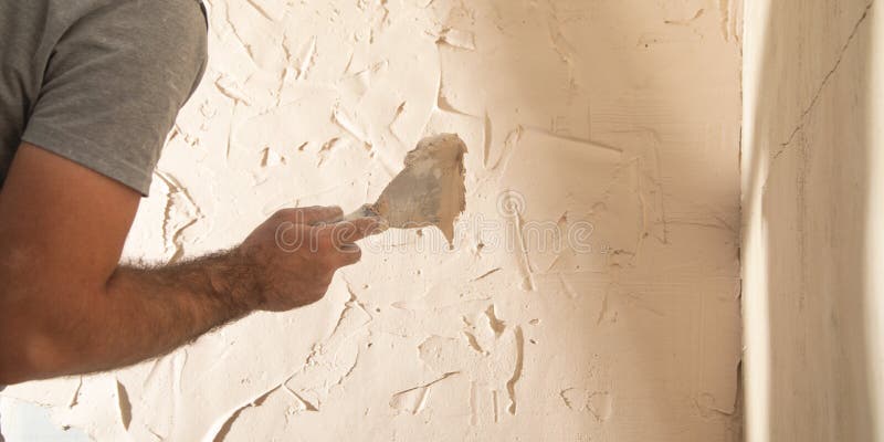 Man is Applying Putty on a Wall. Renovating House Stock Image - Image ...