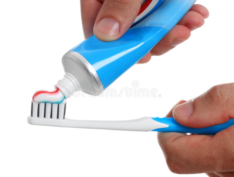 Man Applying Toothpaste on Brush Against White Background, Closeup ...