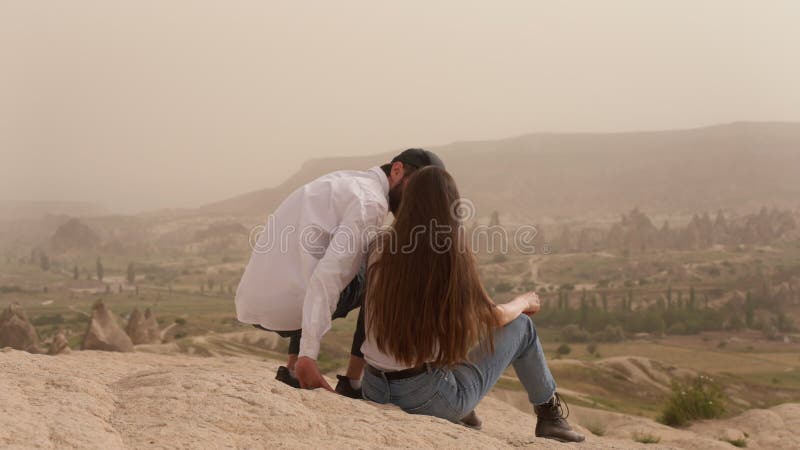 Man Approaching and Hugging Faceless Girlfriend on Cliff Stock Video ...