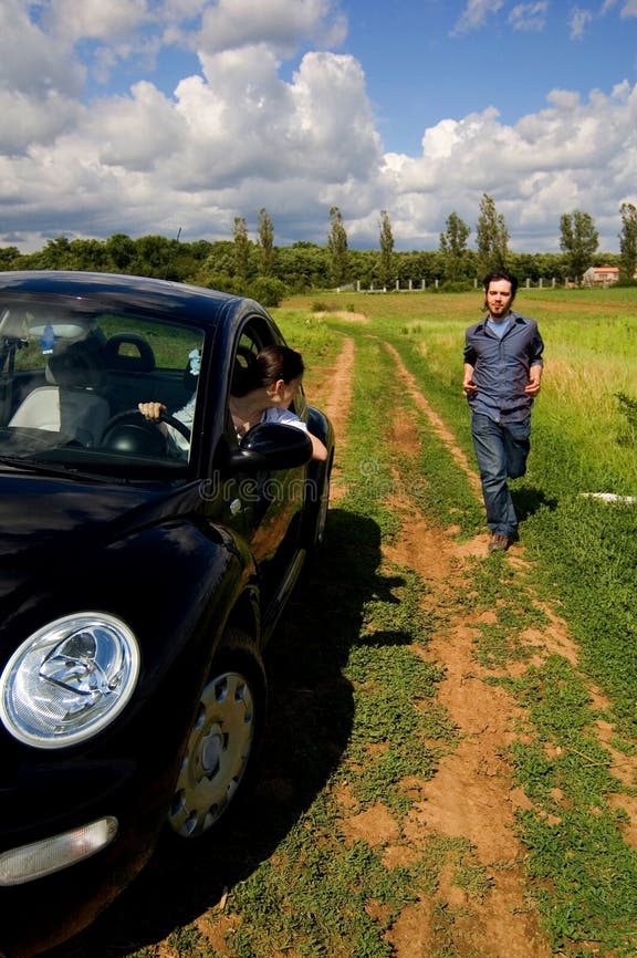 Man Approaching Woman S Car Stock Photo - Image of clouds, field: 1422110