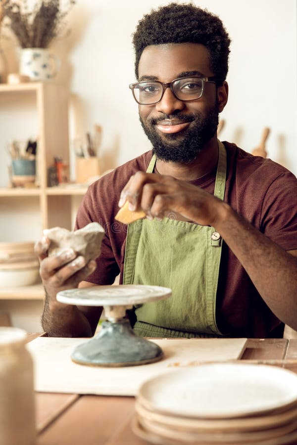 Man in Apron Working in the Pottery Studio and Looking Involved Stock ...