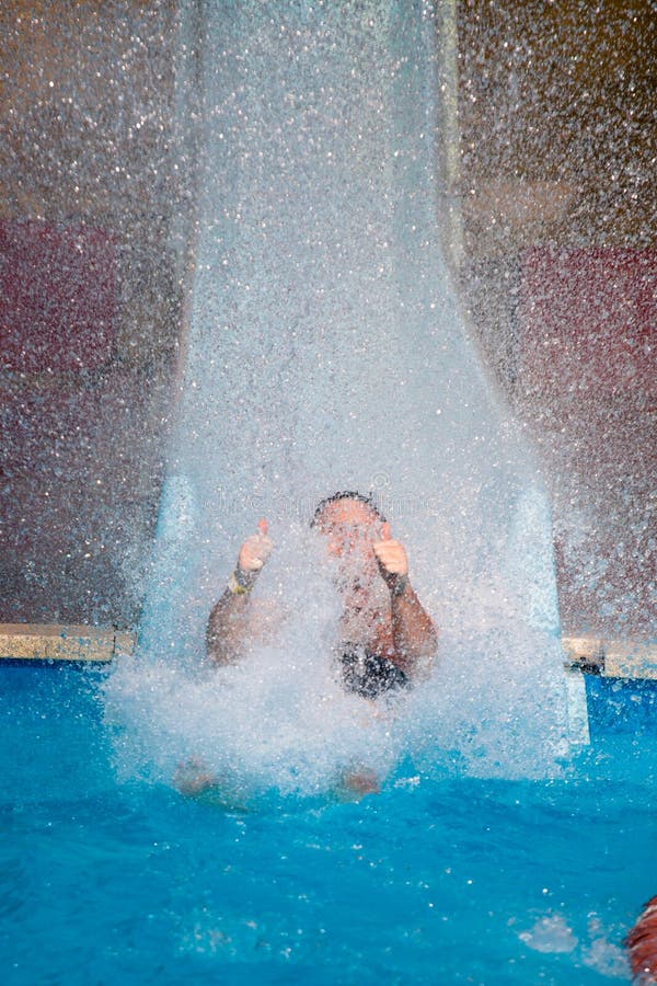 Young People Having Fun on Water Slides in Aqua Park Stock Photo ...