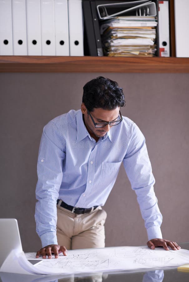 Man, Architect and Review Blueprint for Renovation Project ...