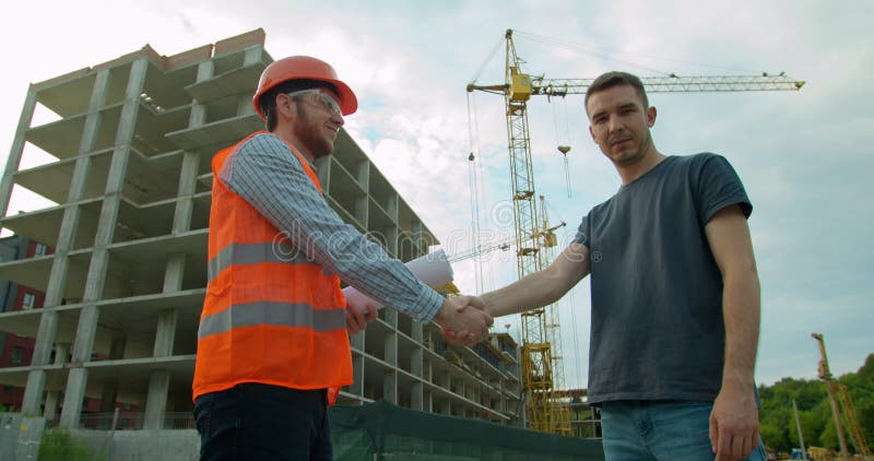 Man Architects Engineers and Male Client Shaking Hands at Construction ...