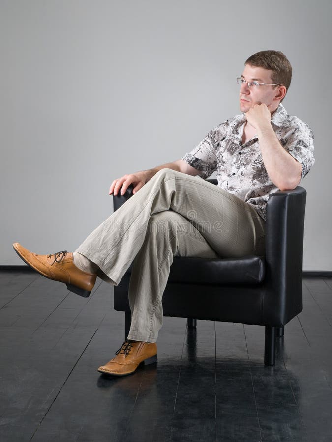 Man in armchair stock photo. Image of studio, comfortable - 12350768