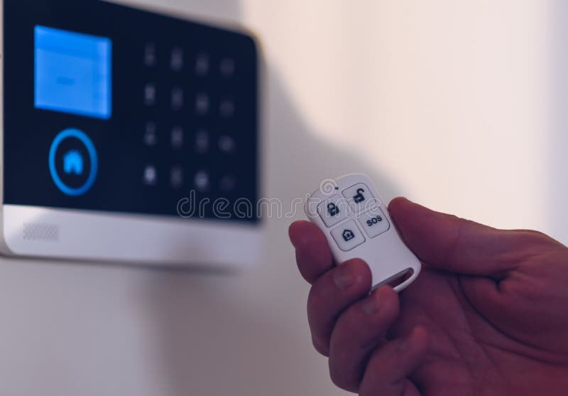Man Arming or Disarming Home Security Alarm. Stock Image - Image of ...