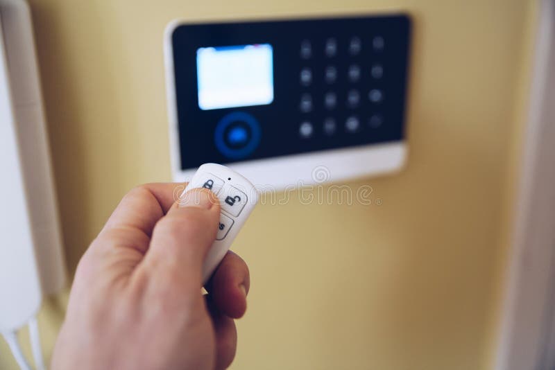 Man Arming or Disarming Home Security Alarm Stock Photo - Image of ...