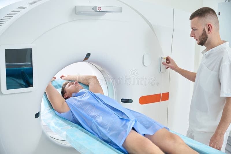 Radiographer is Preparing Adult Patient for CT Procedure Stock Photo ...