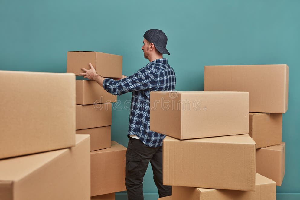 Man Arranging Boxes at Warehouse Stock Photo - Image of container ...