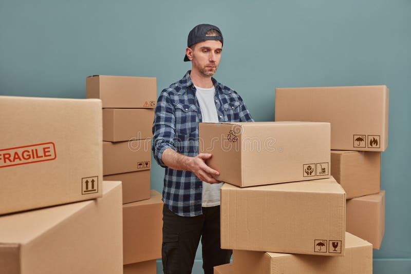 Man Arranging Boxes at Warehouse Stock Image - Image of people ...