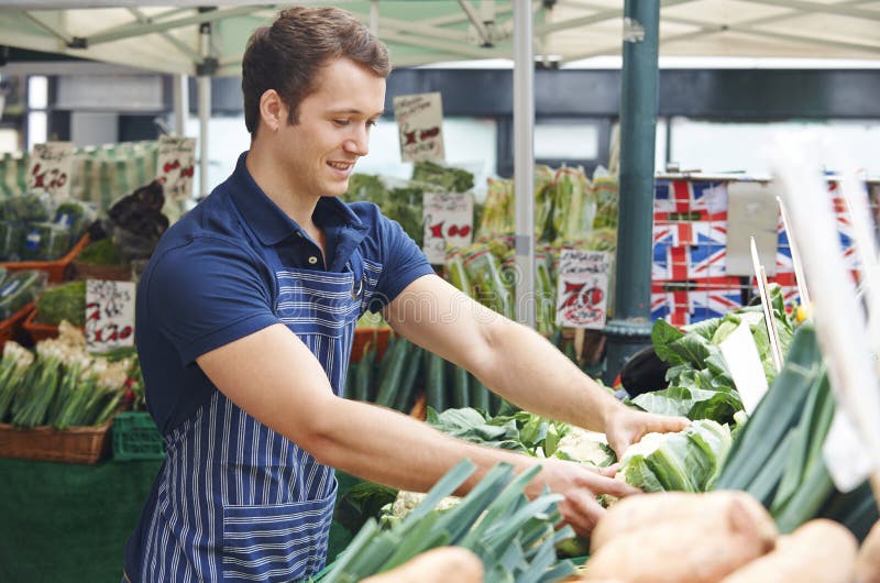 Man Arranging Display on Market Vegetable Stall Stock Photo - Image of ...