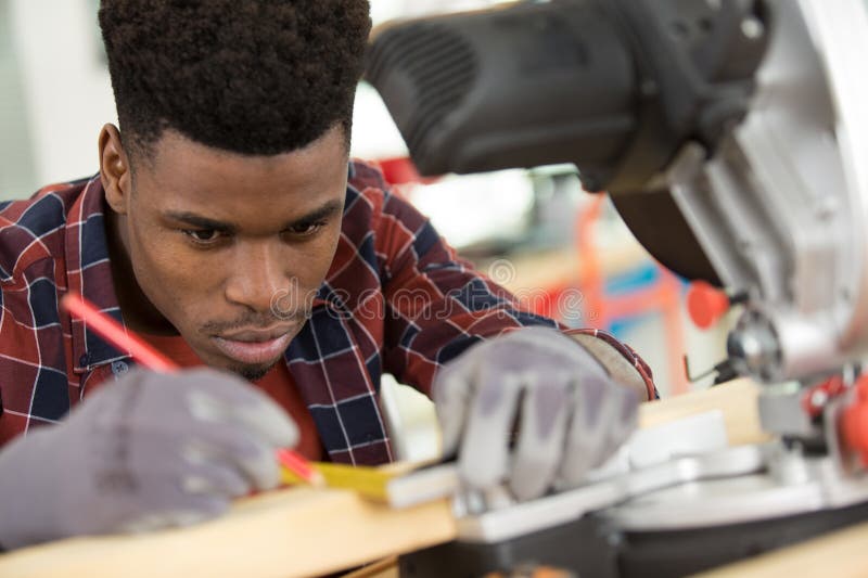 Man As Carpenter in Workshop Concentrates Sawing Wood Stock Image ...