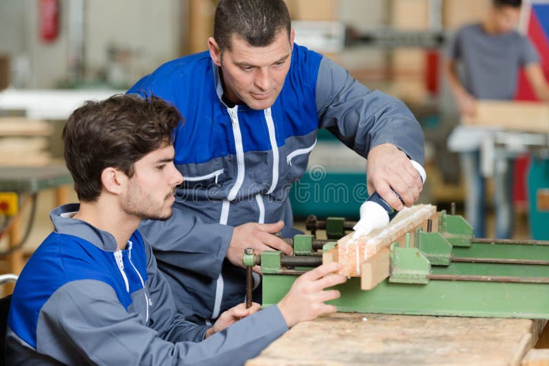 Man as wood apprentice stock image. Image of woman, instrument - 258029389