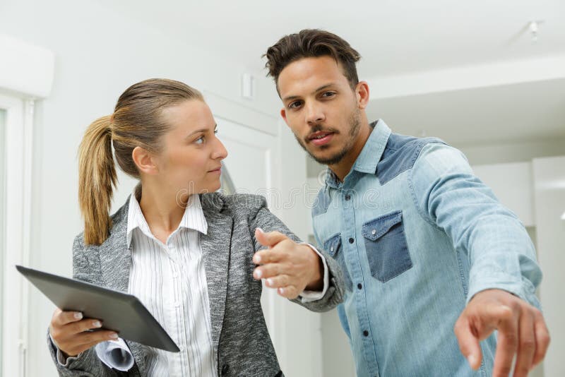 Man Asking Questions To Estate Agent while Visiting Apartment Stock ...