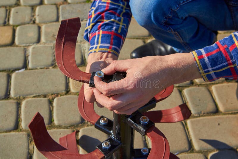 Assembly of Knives on a Cultivator,man Assembles a Shaft with Knives ...