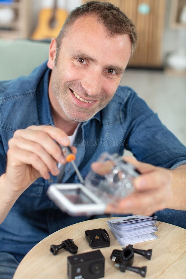 Man Assembling Components Actioncam Stock Photo - Image of middleaged ...