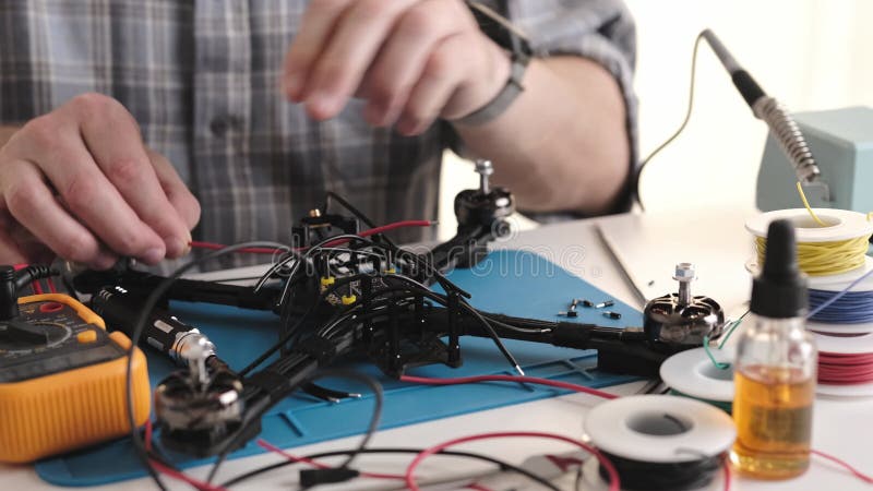 Man Assembling FPV Drone from Components for Hobby Flying Stock Footage ...