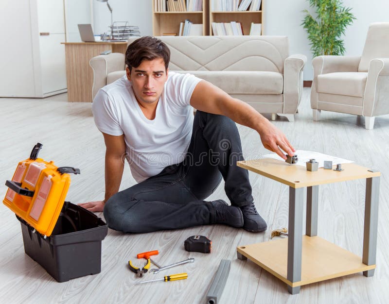 Man Assembling Furniture at Home Stock Image - Image of fabric ...