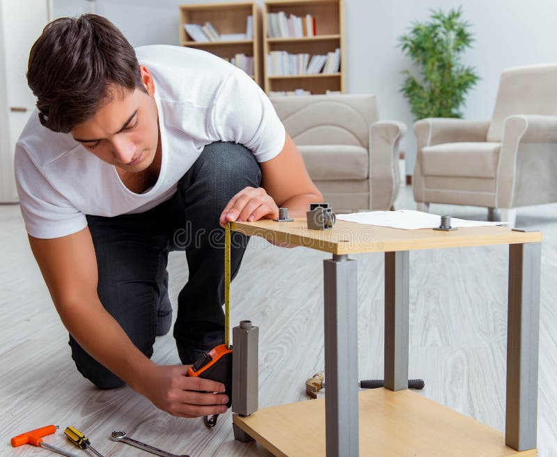 Man Assembling Furniture at Home Stock Photo - Image of furniture ...