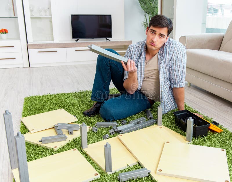Man Assembling Furniture at Home Stock Photo - Image of relocation ...