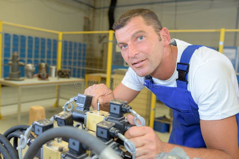 Man Assembling Machine Parts Stock Image - Image of handsome, metal ...