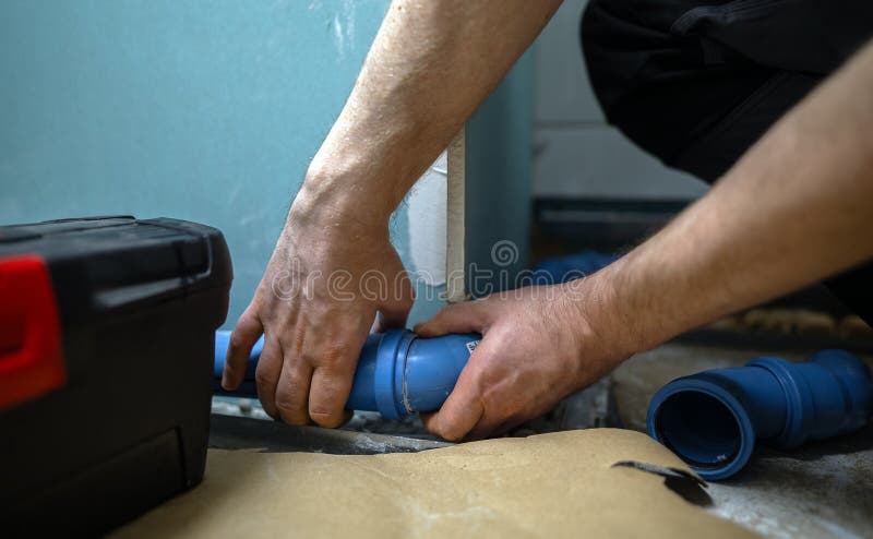 Man Assembling Plumbing Pipes Stock Photo - Image of construction ...