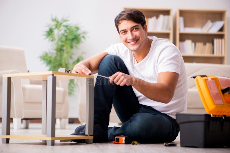 The Man Assembling Shelf at Home Stock Photo - Image of craftsman ...