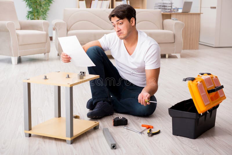 The Man Assembling Shelf at Home Stock Photo - Image of assembling ...