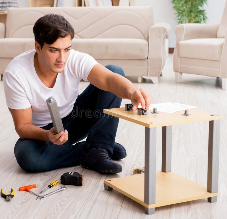 Man Assembling Shelf at Home Stock Photo - Image of assembly ...
