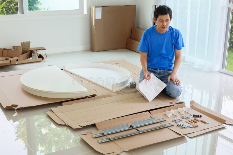 Man Assembling White Round Table Furniture at Home Stock Photo - Image ...